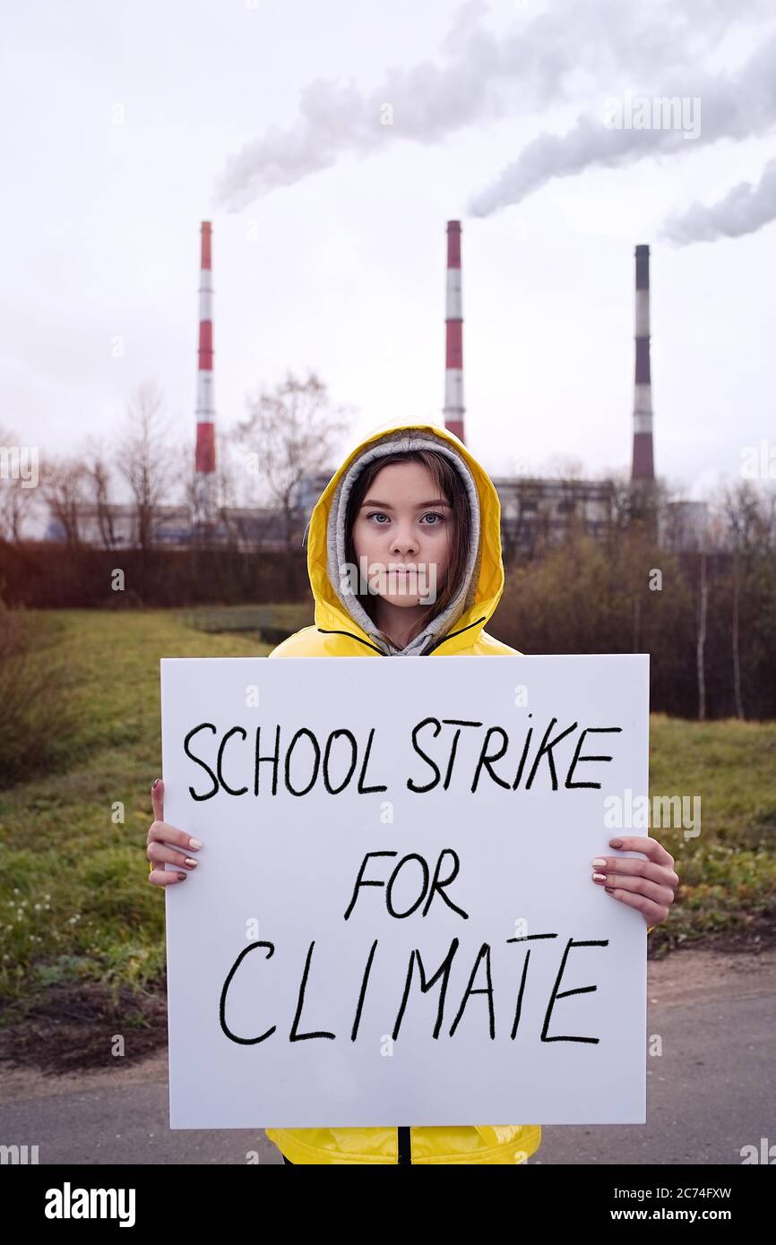 Teenager girl holding placard during global strike for climate change ...