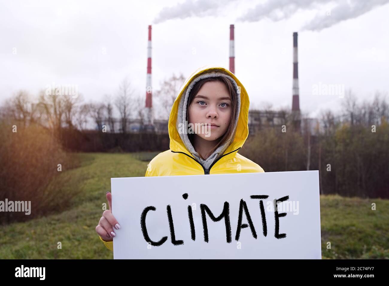 Teenager girl holding placard during global strike for climate change ...