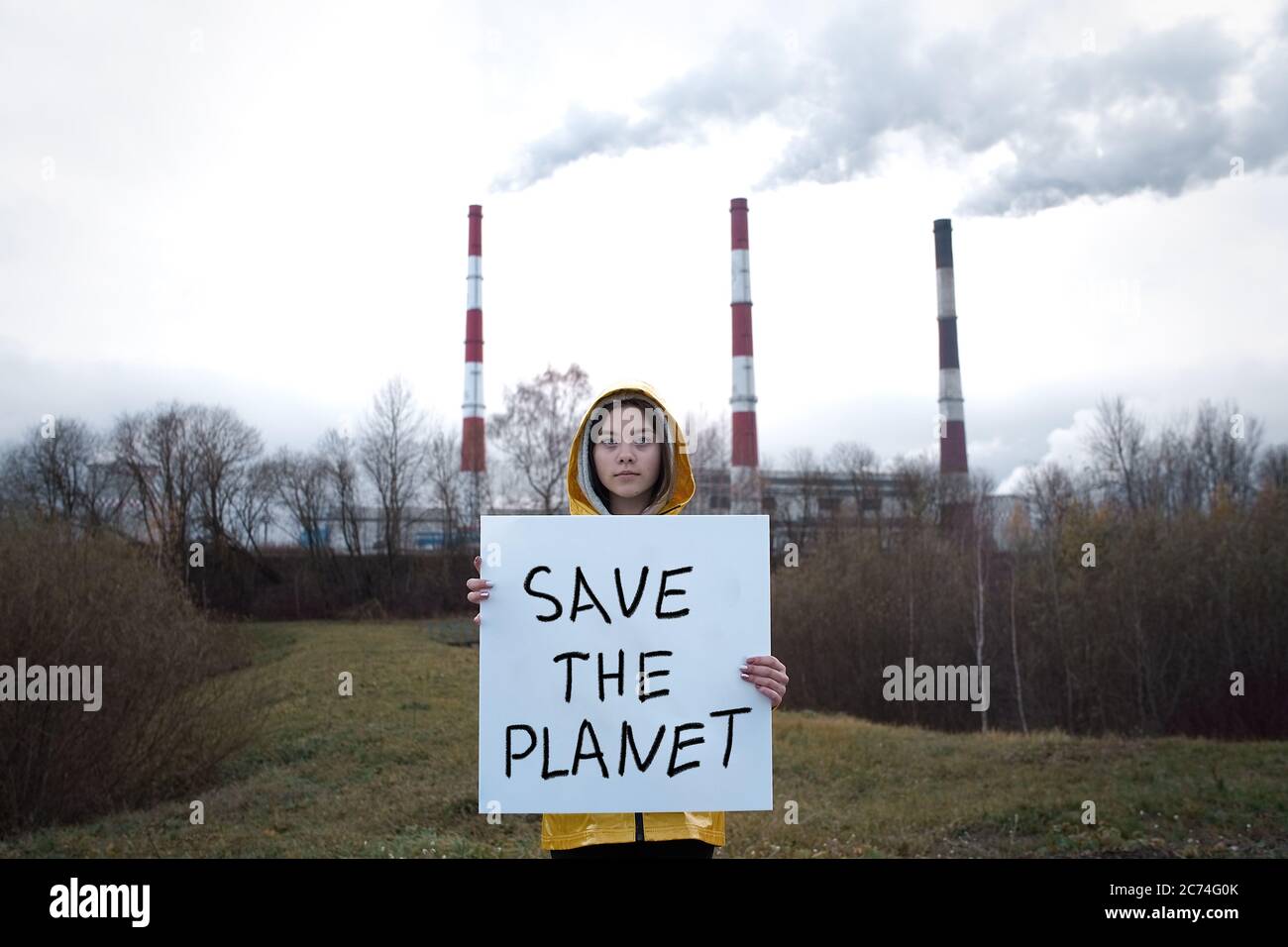 Teenager girl holding placard during global strike for climate change ...