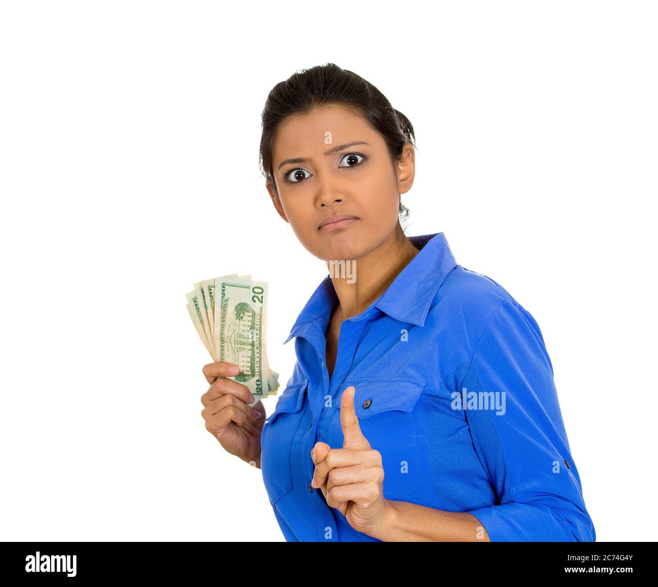 Closeup portrait of a greedy young woman holding dollar banknotes ...