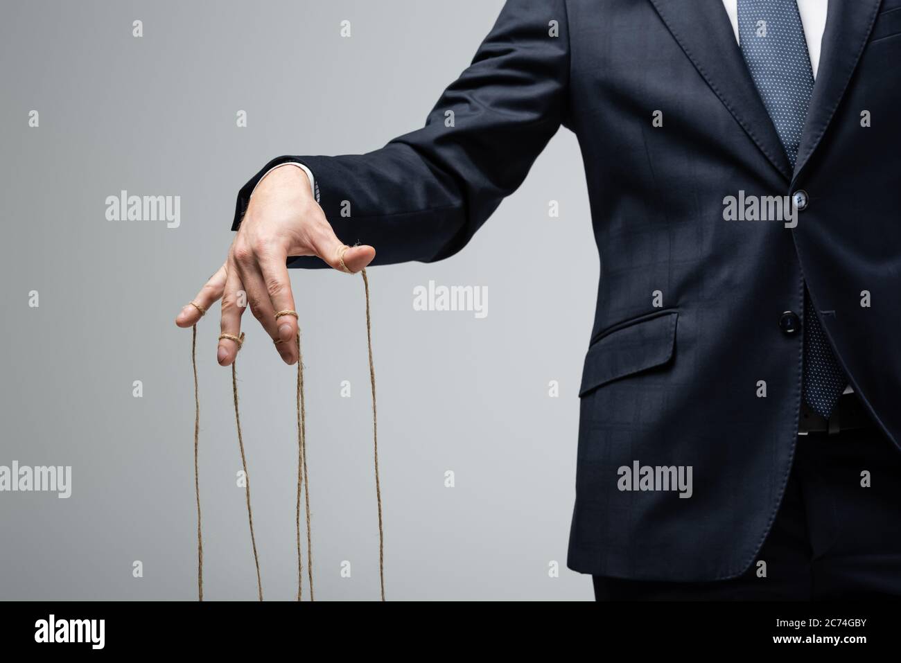 Man hand puppet strings hi-res stock photography and images - Alamy