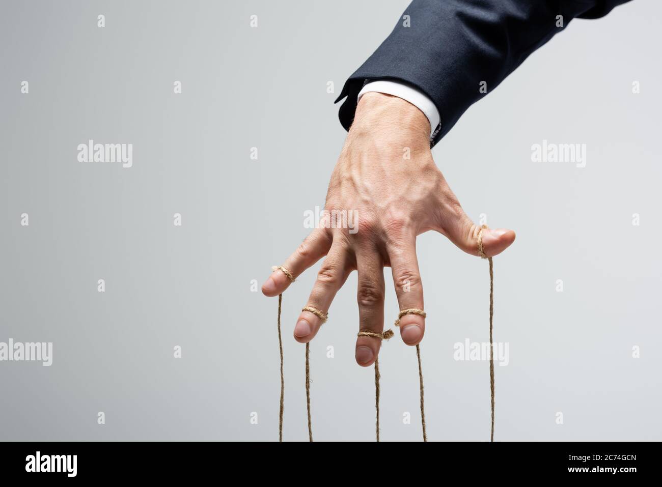 Man hand puppet strings hi-res stock photography and images - Alamy