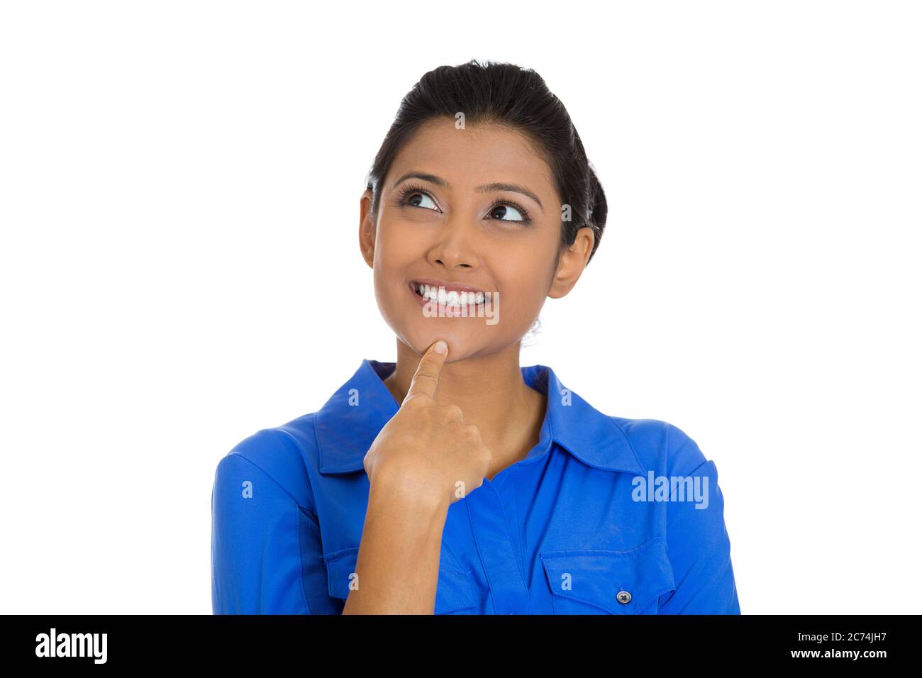 Portrait of a smiling young woman, student thinking looking up having ...