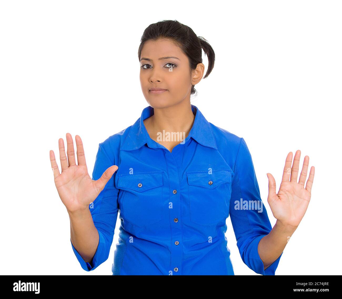 Portrait of a furious mad angry annoyed young woman raising hands ...