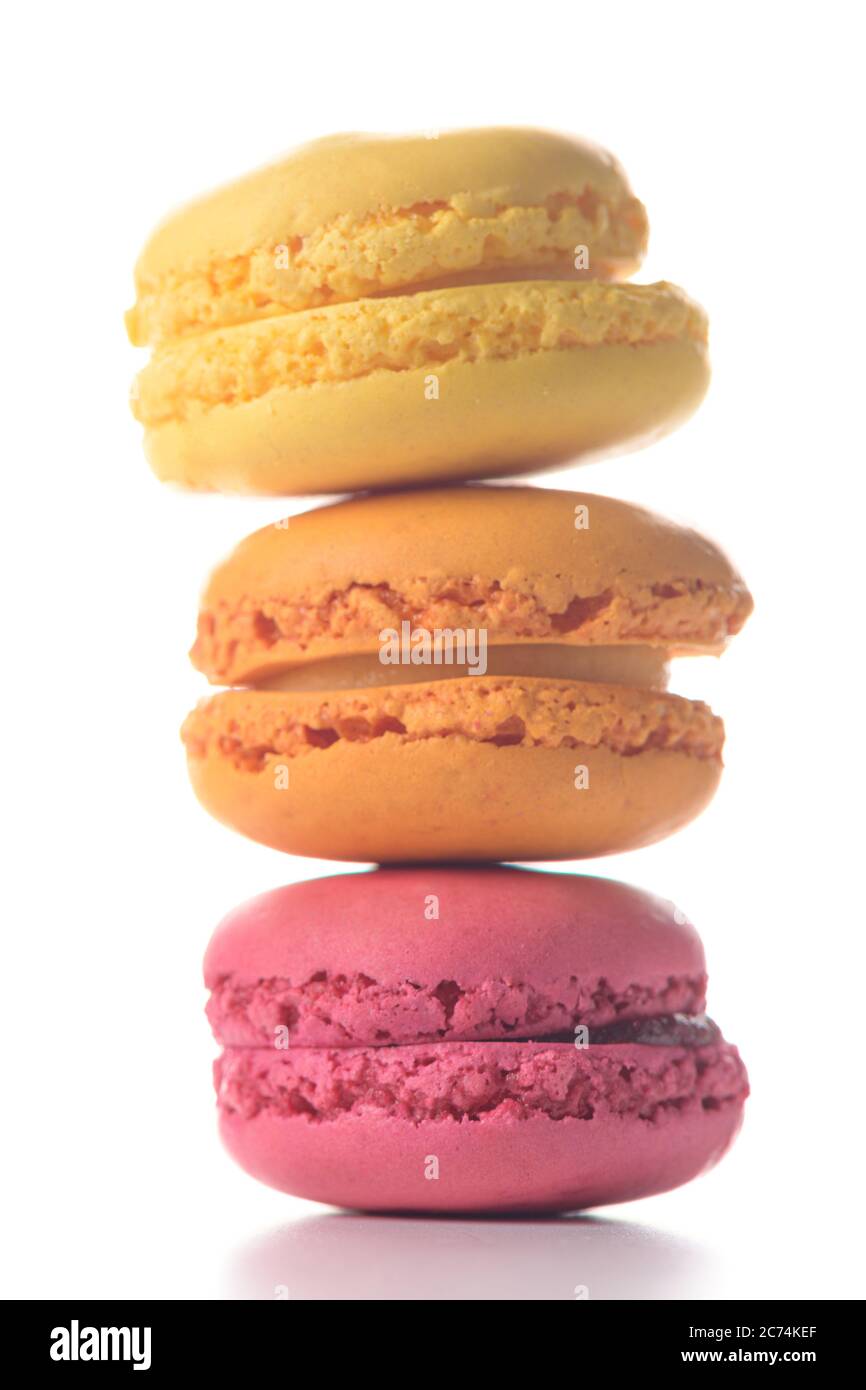 Three macaroons standing on top of each other on white background Stock ...