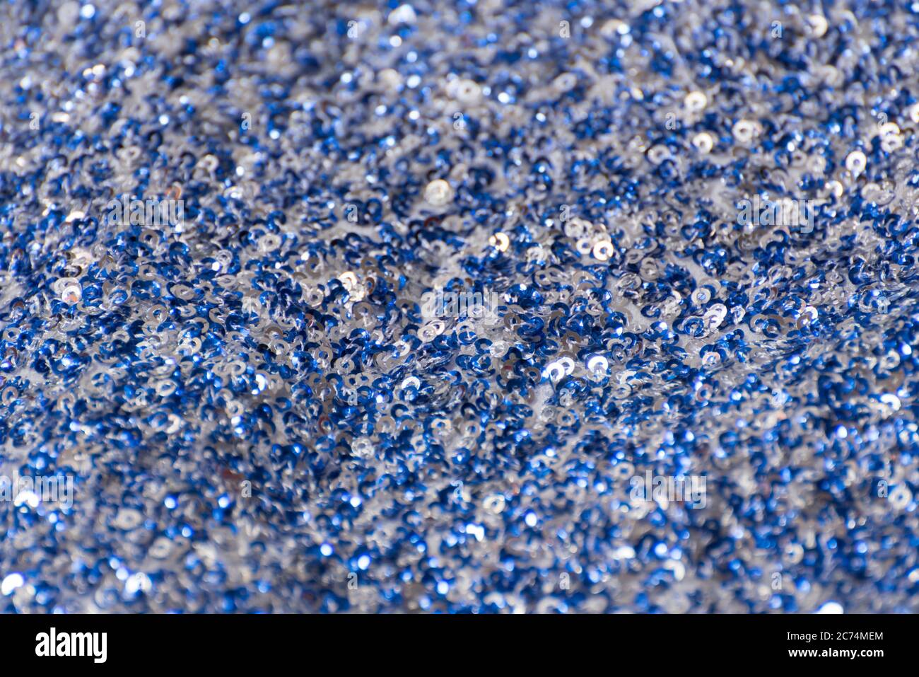 Fabric texture with white and blue sequins. Close-up Stock Photo - Alamy