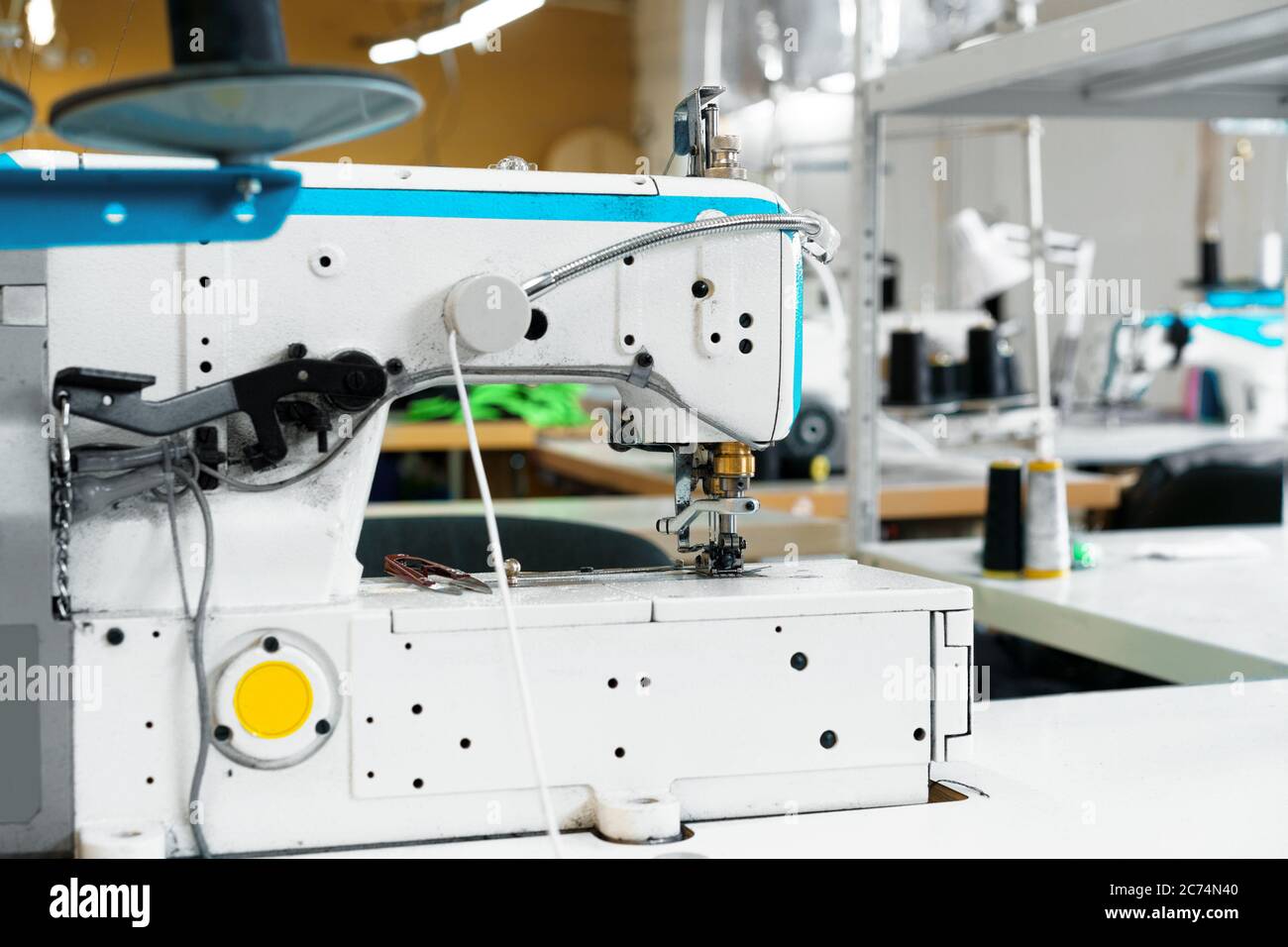 Sewing department of a textile factory interior Stock Photo - Alamy