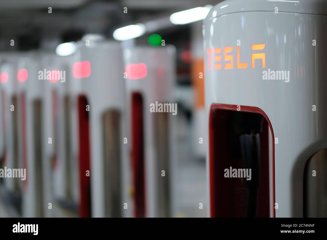 Close up a row of Tesla's charging piles in Shanghai. Blur background ...