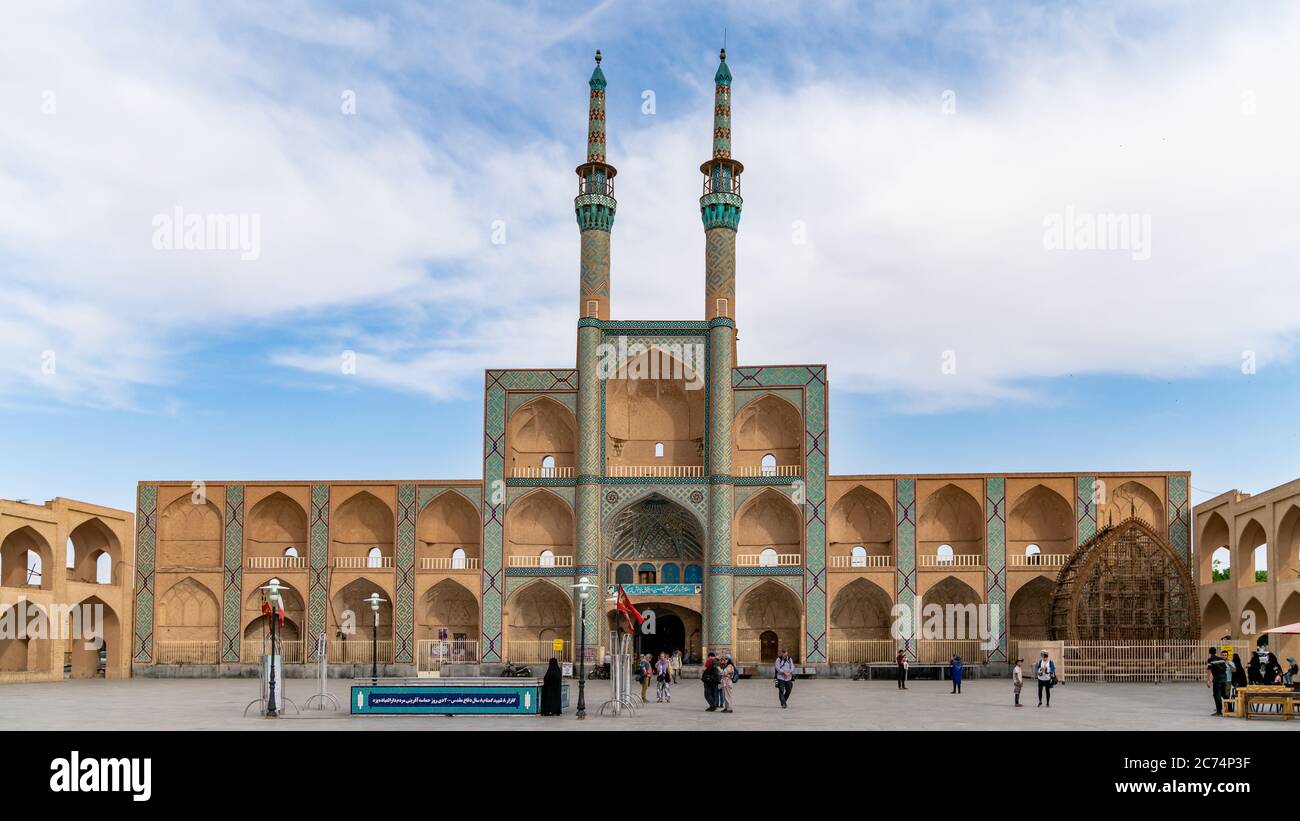 Yazd, Iran - May 2019: Local people and tourists around the gate and ...