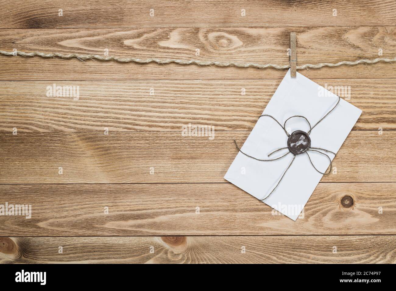 Mail envelope on rope Stock Photo - Alamy