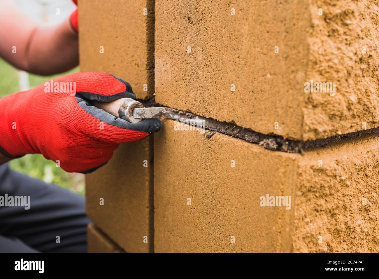 Craftsman man laying blocks hi-res stock photography and images - Alamy