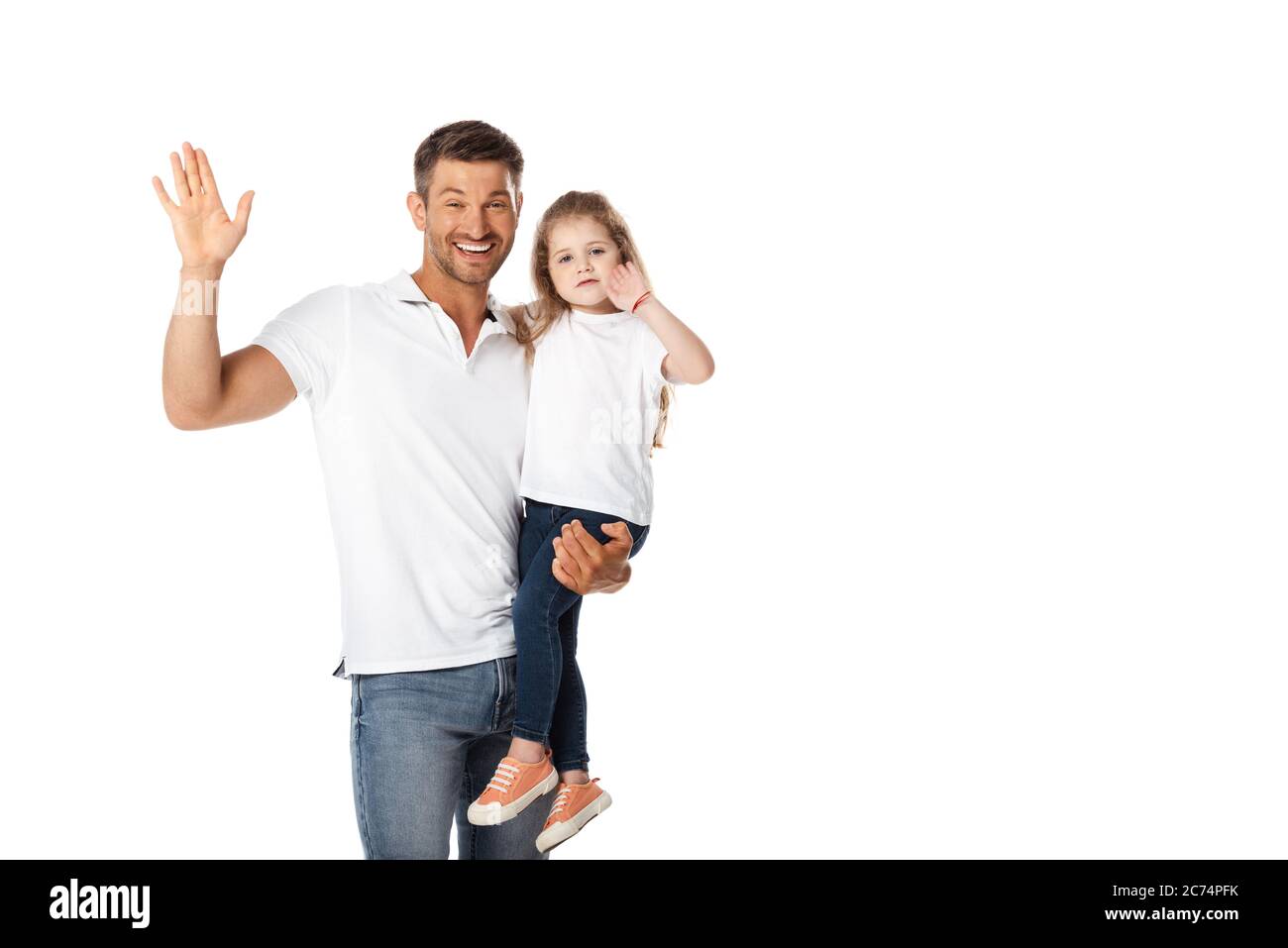 cheerful father holding in arms cute daughter and waving hand isolated ...