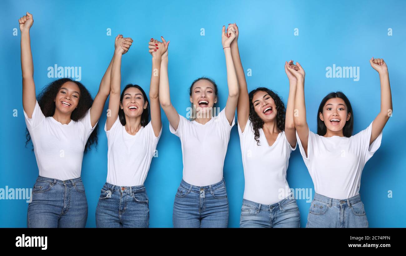 Multiracial women holding hands hi-res stock photography and images - Alamy