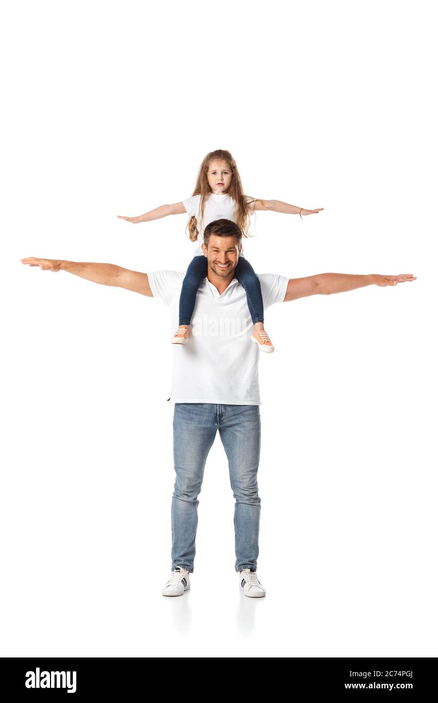 cute kid with outstretched hands sitting on shoulders of cheerful ...