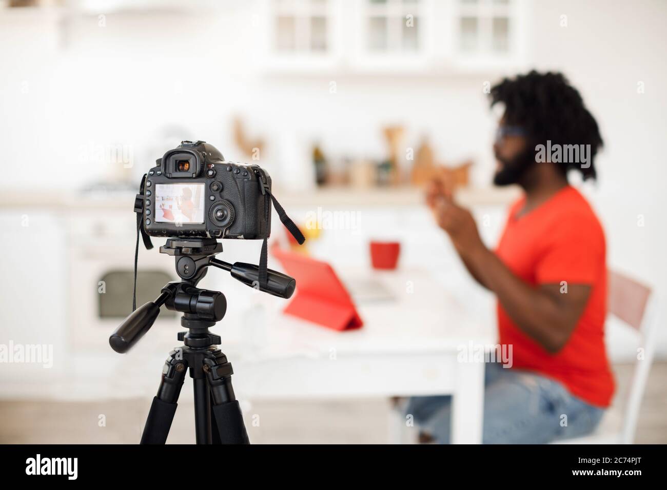 Young man recording video tutorial hi-res stock photography and images ...