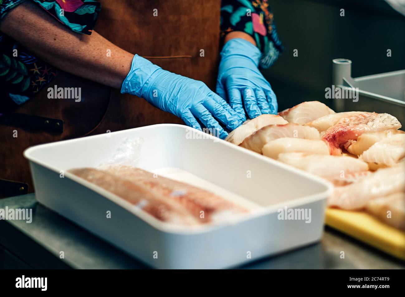 chopped raw fish pieces ready in a restaurant kitchen Stock Photo - Alamy