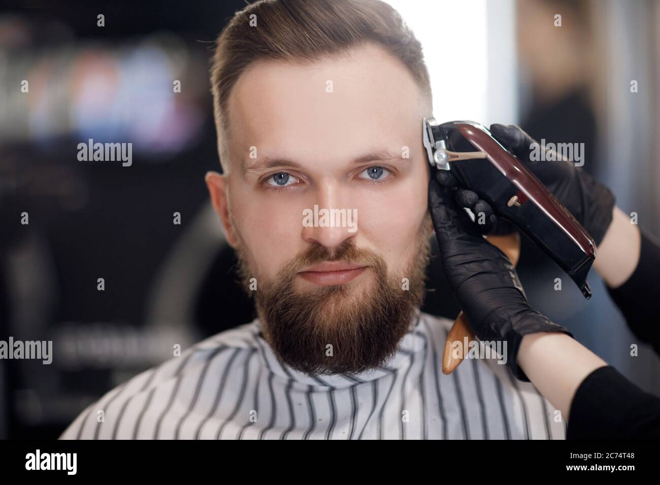 Close up face portrait in barbershop, man with beard Stock Photo - Alamy