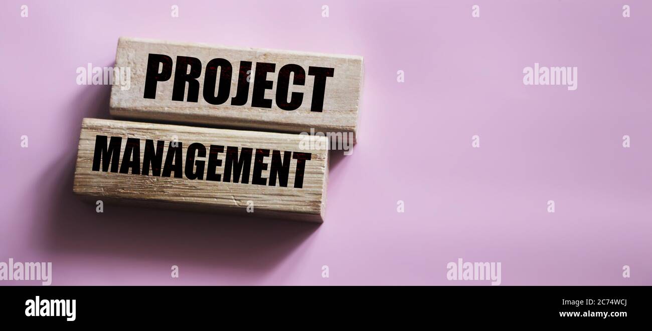 Projects Management on wooden blocks on pink. Business concept Stock ...