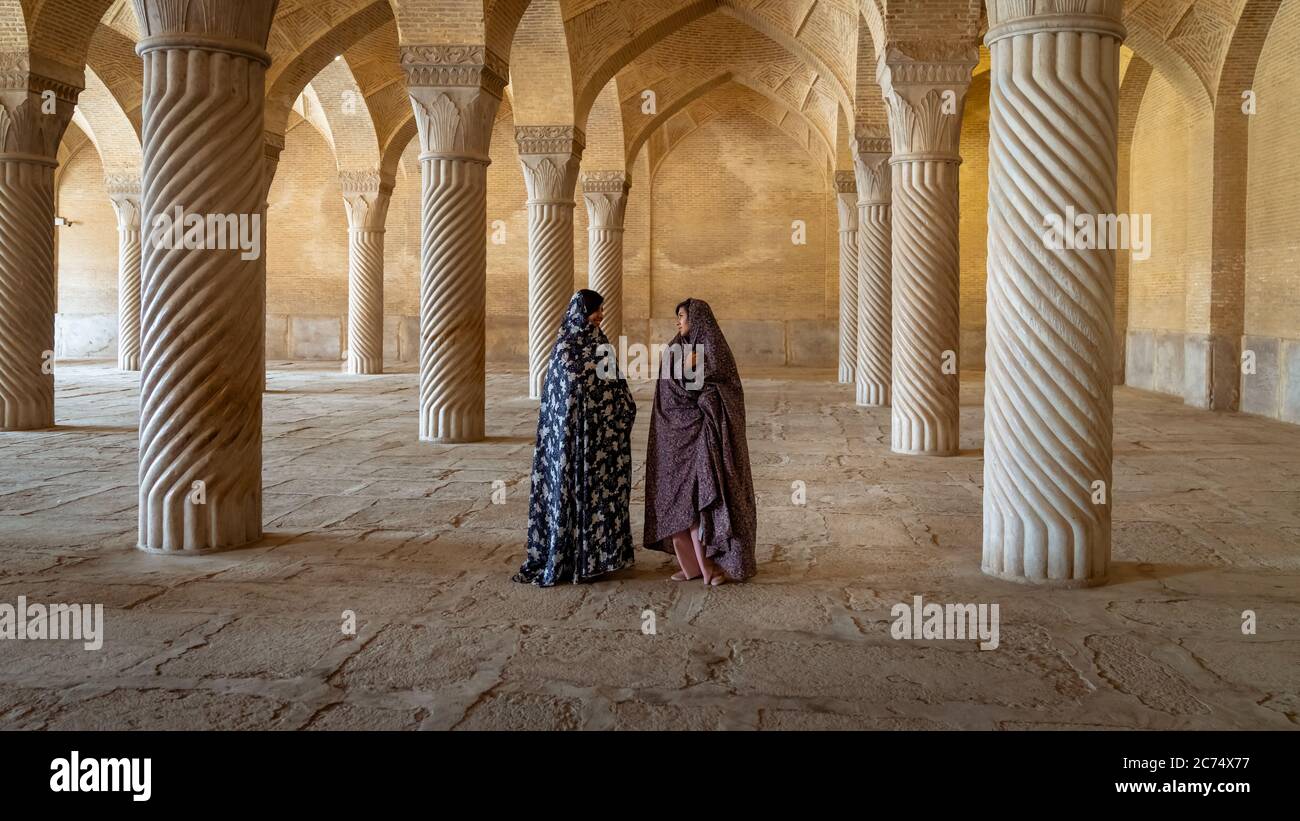 Shiraz, Iran - May 2019: Two Iranian women talking in prayer hall of ...