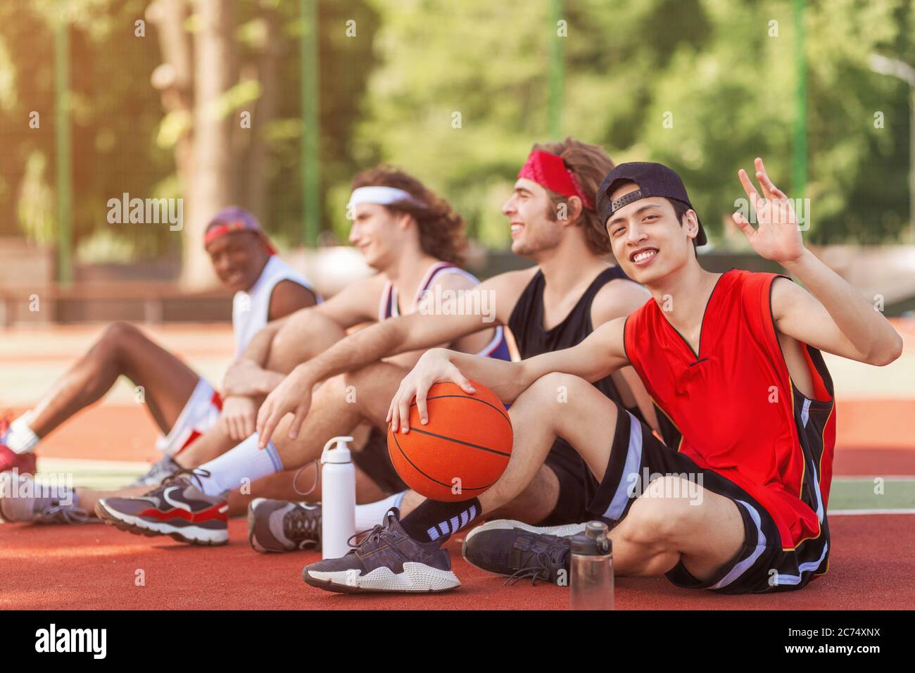 Happy diverse male basketball players hi-res stock photography and ...