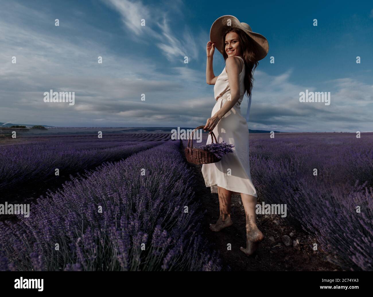 Beautiful young woman walking field hi-res stock photography and images ...