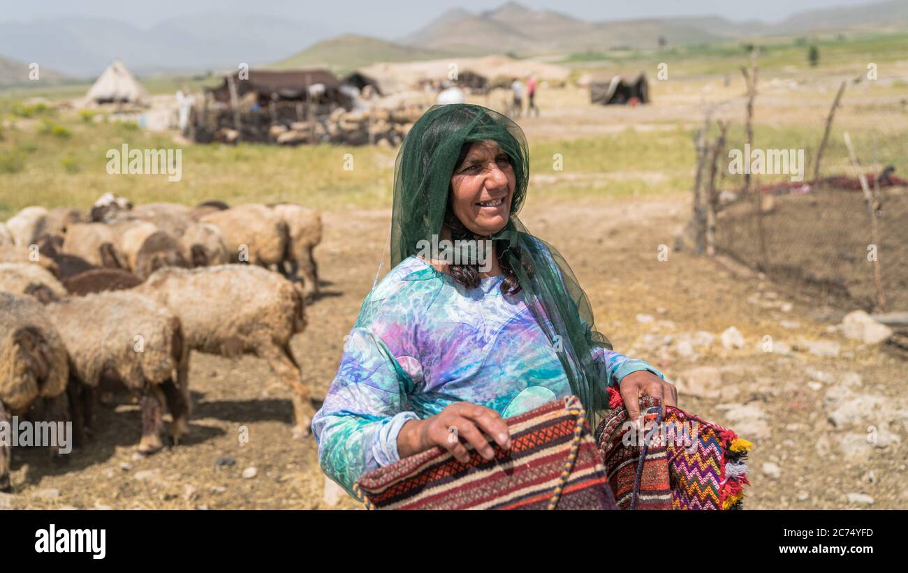 Shiraz, Iran - May 2019: Qashqai nomadic woman selling handicraft ...