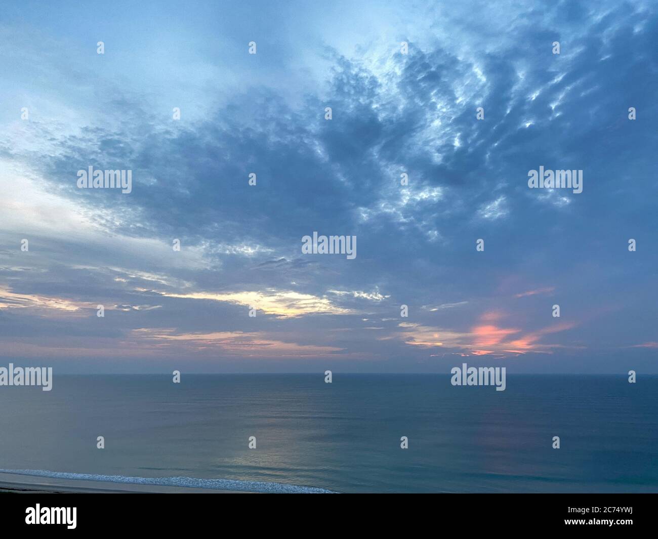 A colorful sunrise over the ocean on a beautiful summer morning Stock ...