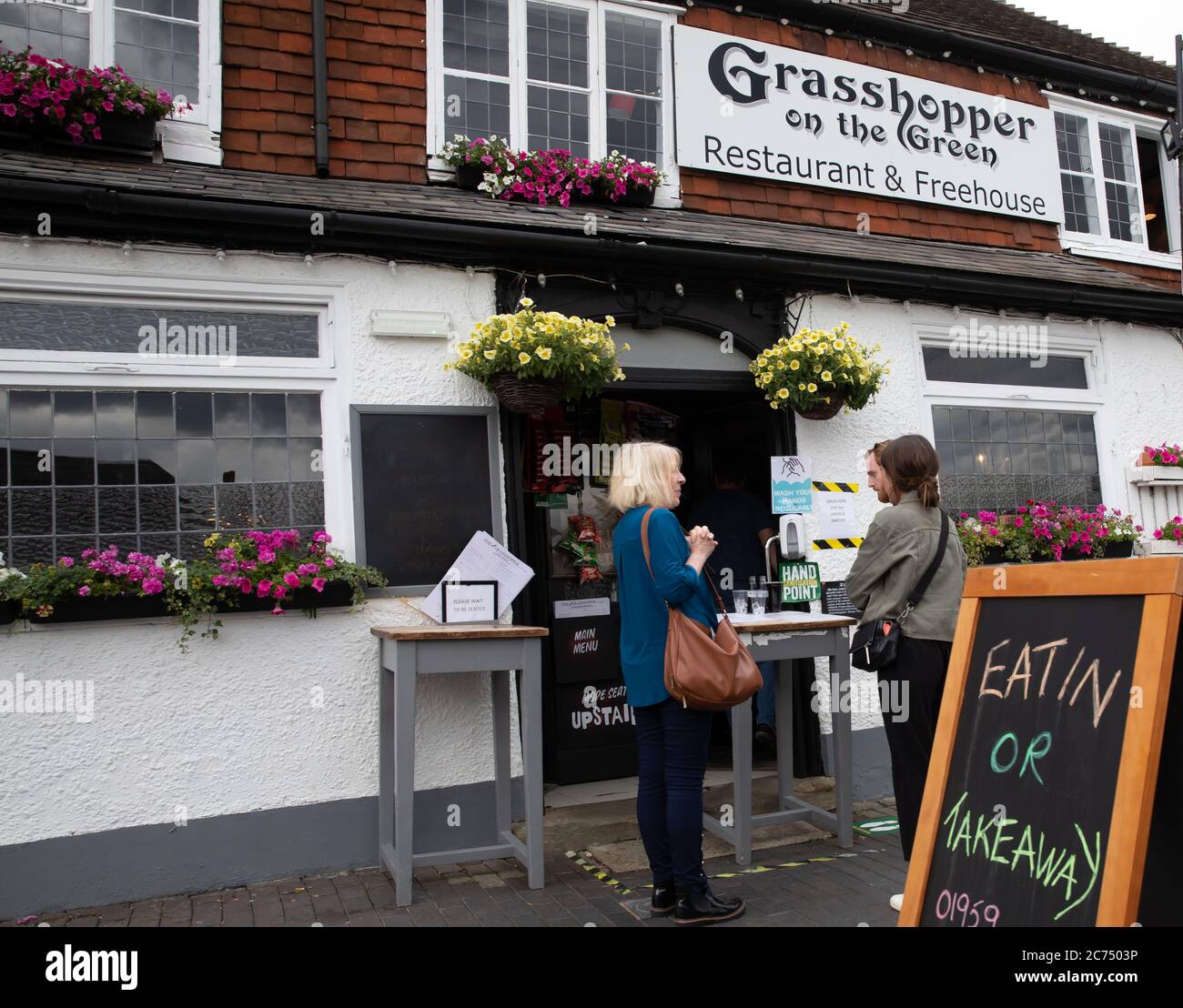Westerham,Kent,UK,14th July 2020,People queue outside Grasshopper on ...