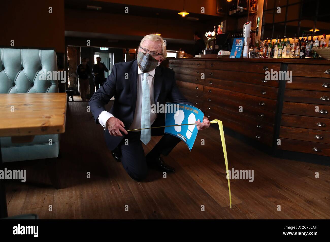 Scottish Conservative leader Jackson Carlaw measures a floor marking ...