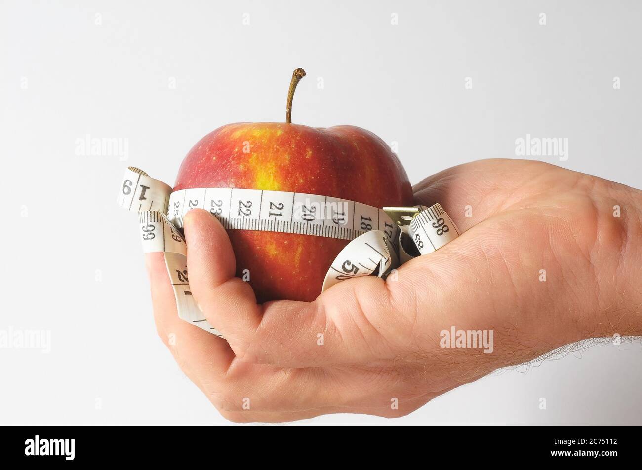 Diet Apple and Meter on the Hand on a White Background Stock Photo - Alamy