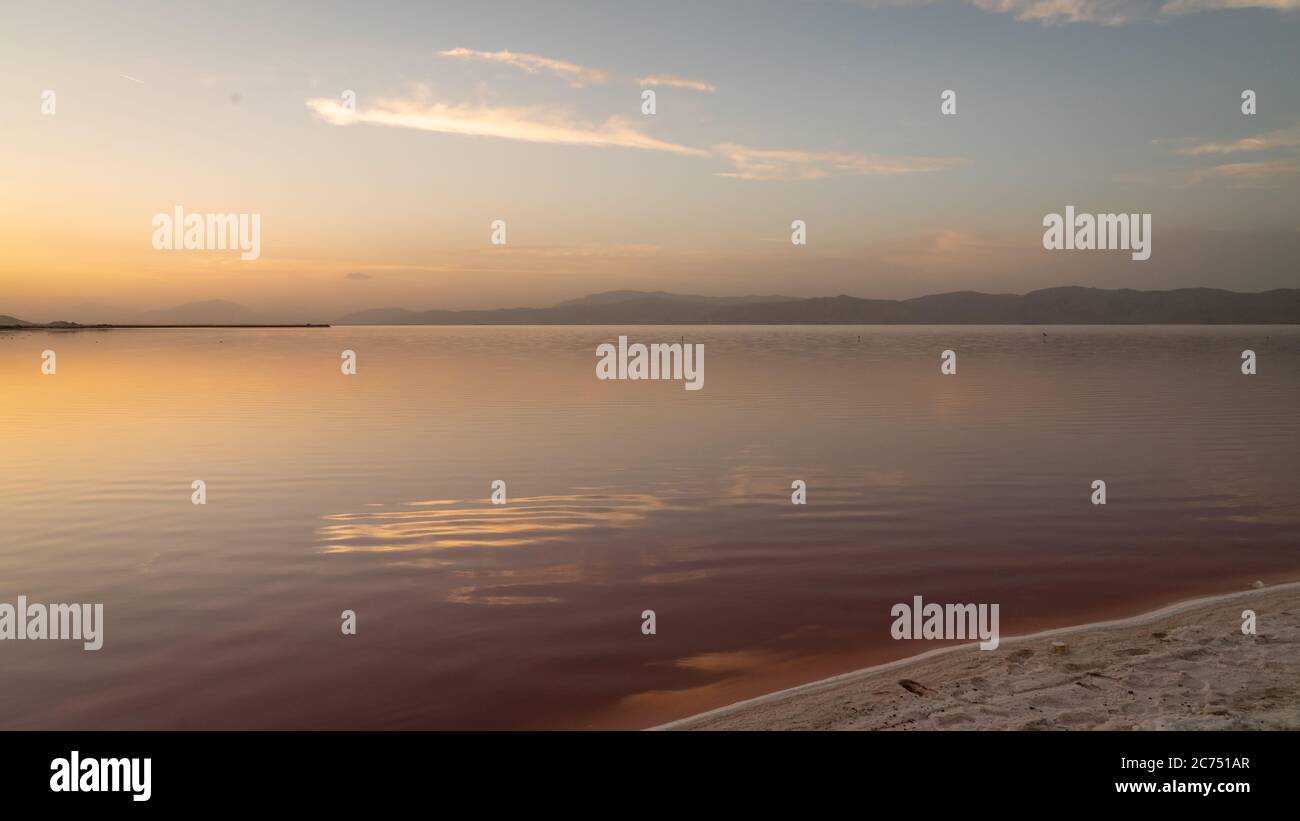 Maharloo pink lake in Shiraz during sunset with pink colored water ...