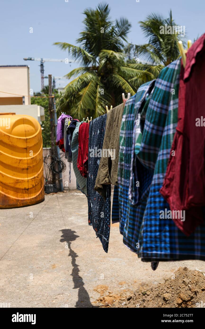 Dry clothes in bright colors in the sunlight Stock Photo - Alamy