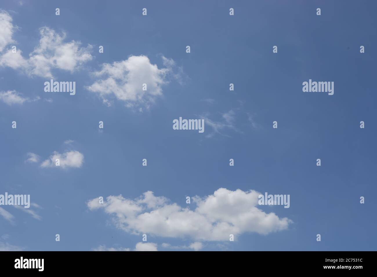blue sky background with a tiny cloud Stock Photo - Alamy