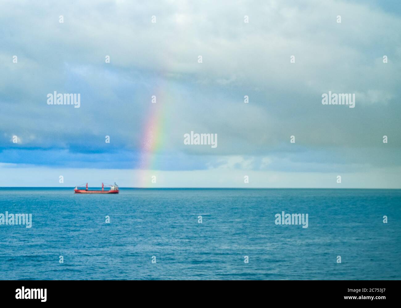 Rainbow in the sea after rain and thunderstorms. Colorful views of the ...