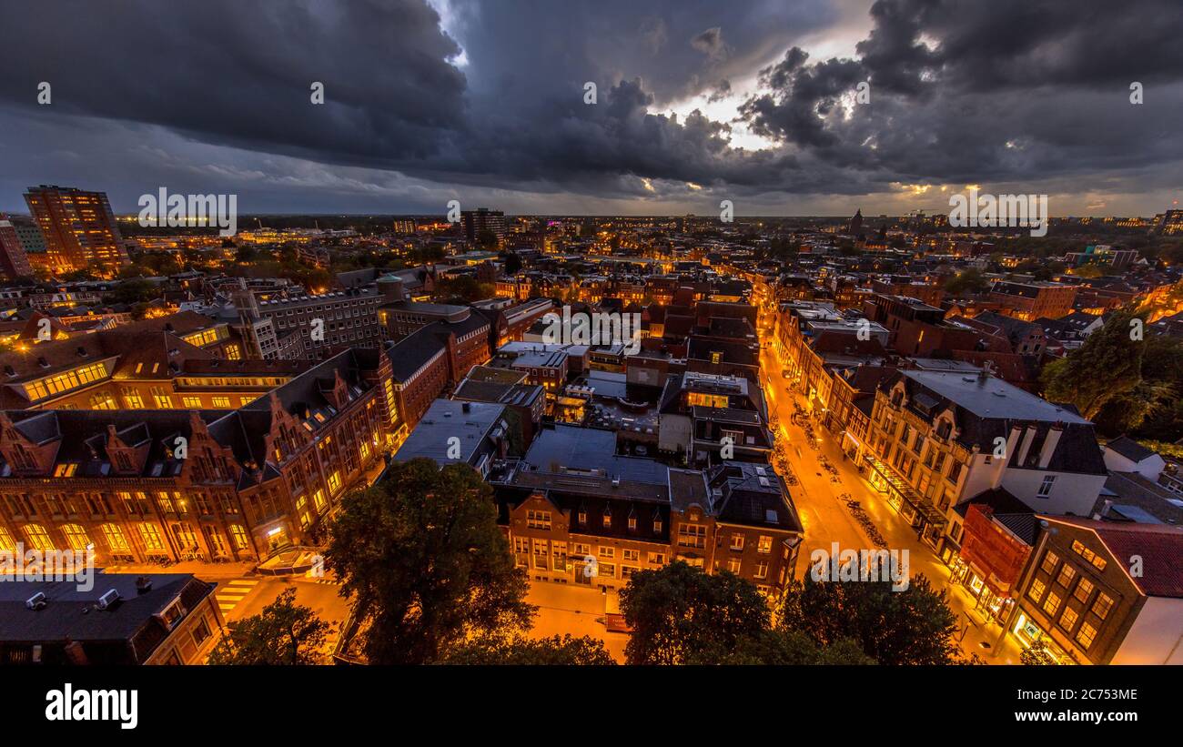 Aerial view of historic town centre of Groningen city at night. The ...