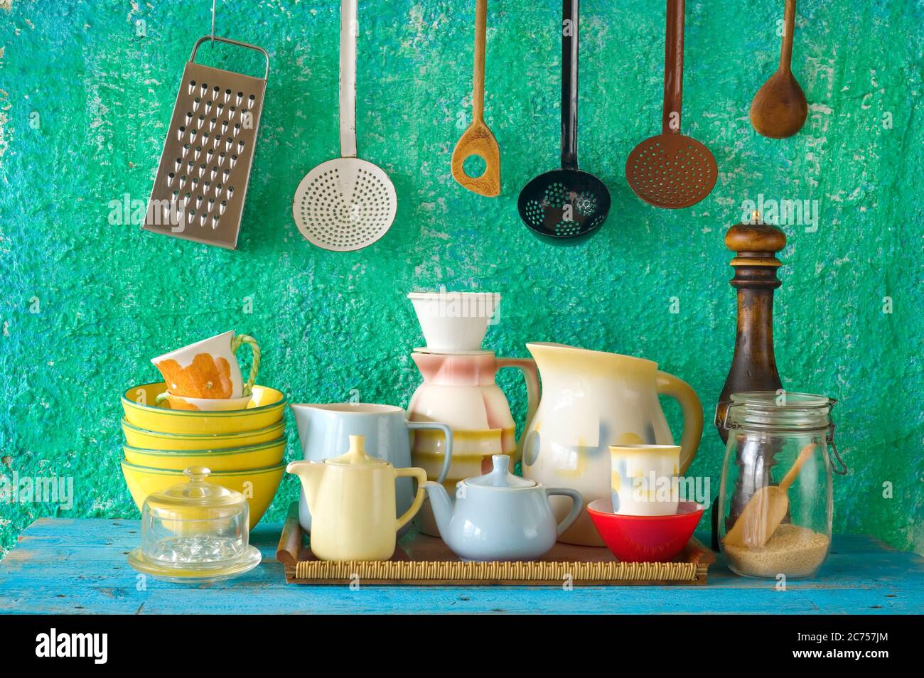 collection of vintage kitchenware, green wall background Stock Photo ...