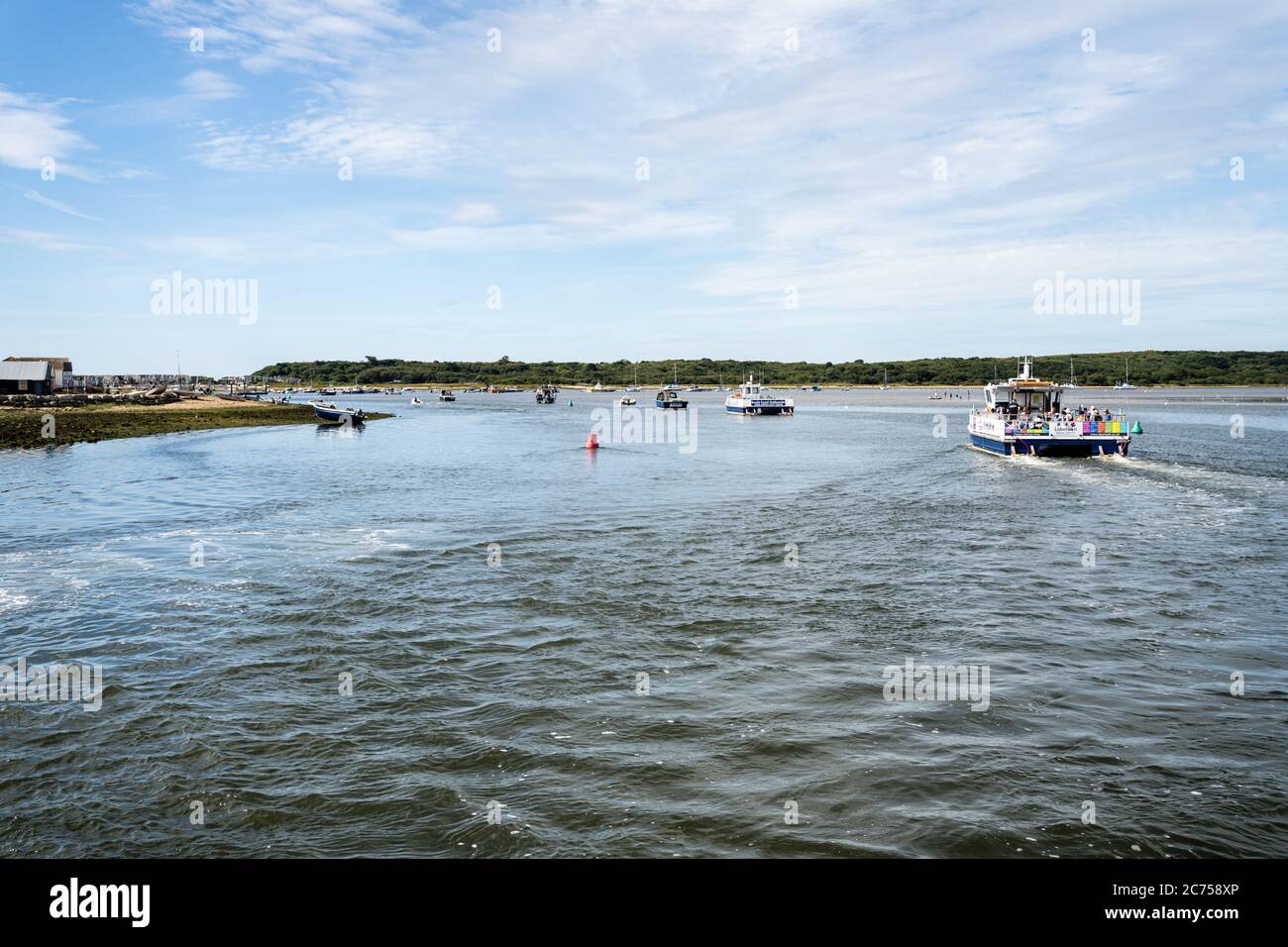 Mudeford ferry crossing from the quay to sandbank Stock Photo - Alamy