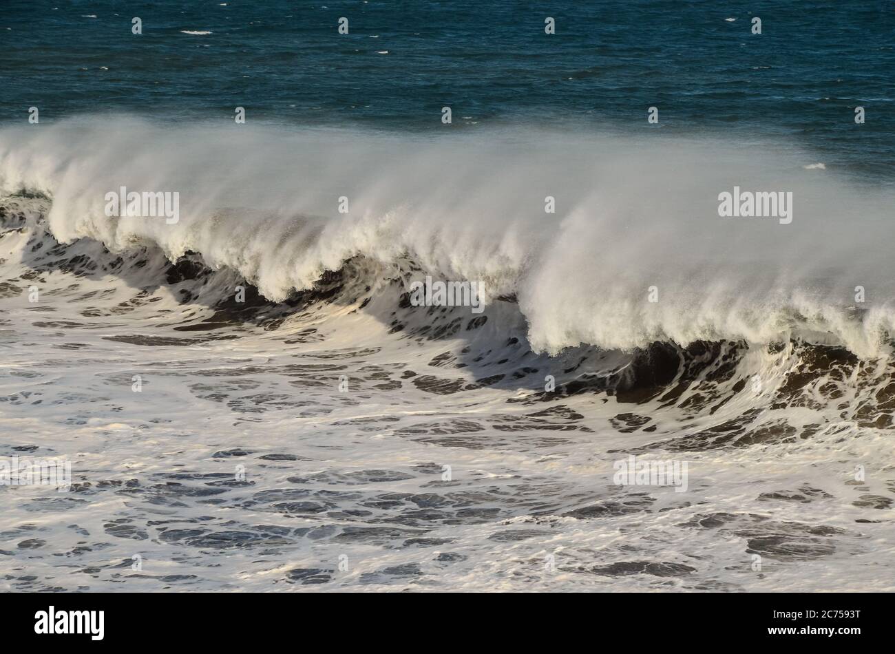 Big Blue Wave Breaks in the Atlantic Ocean Stock Photo - Alamy