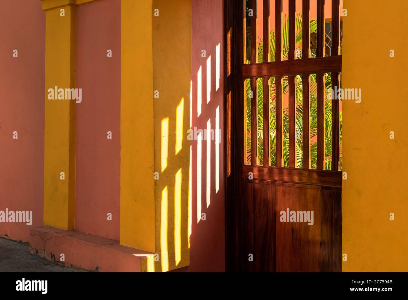 Light and shadow abstract with sunlight hitting the colorful walls ...