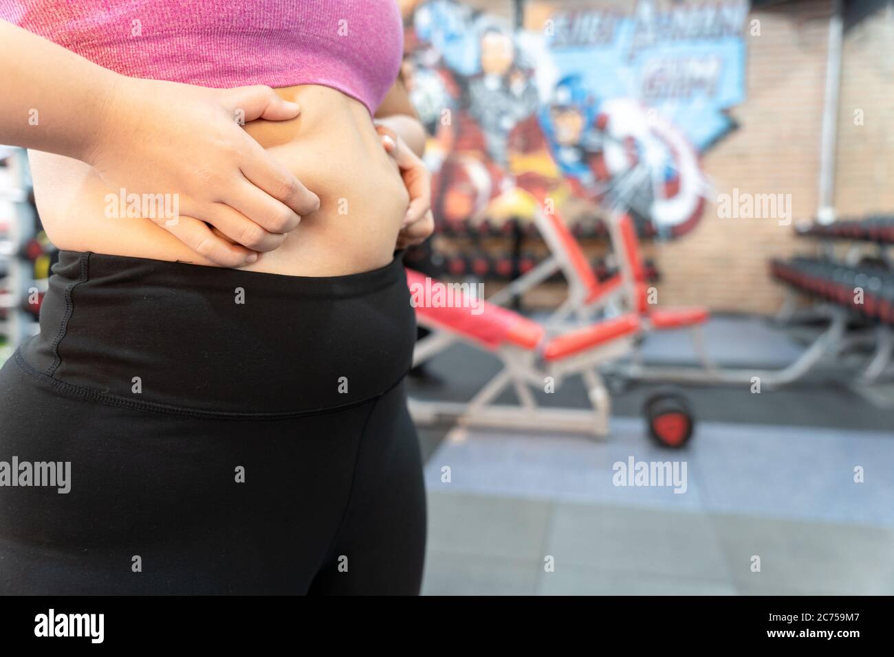 Fat woman holding excessive fat belly, overweight fatty belly at ...