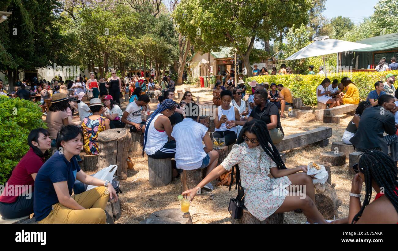 Johannesburg, South Africa - October 2019: People eating and ...