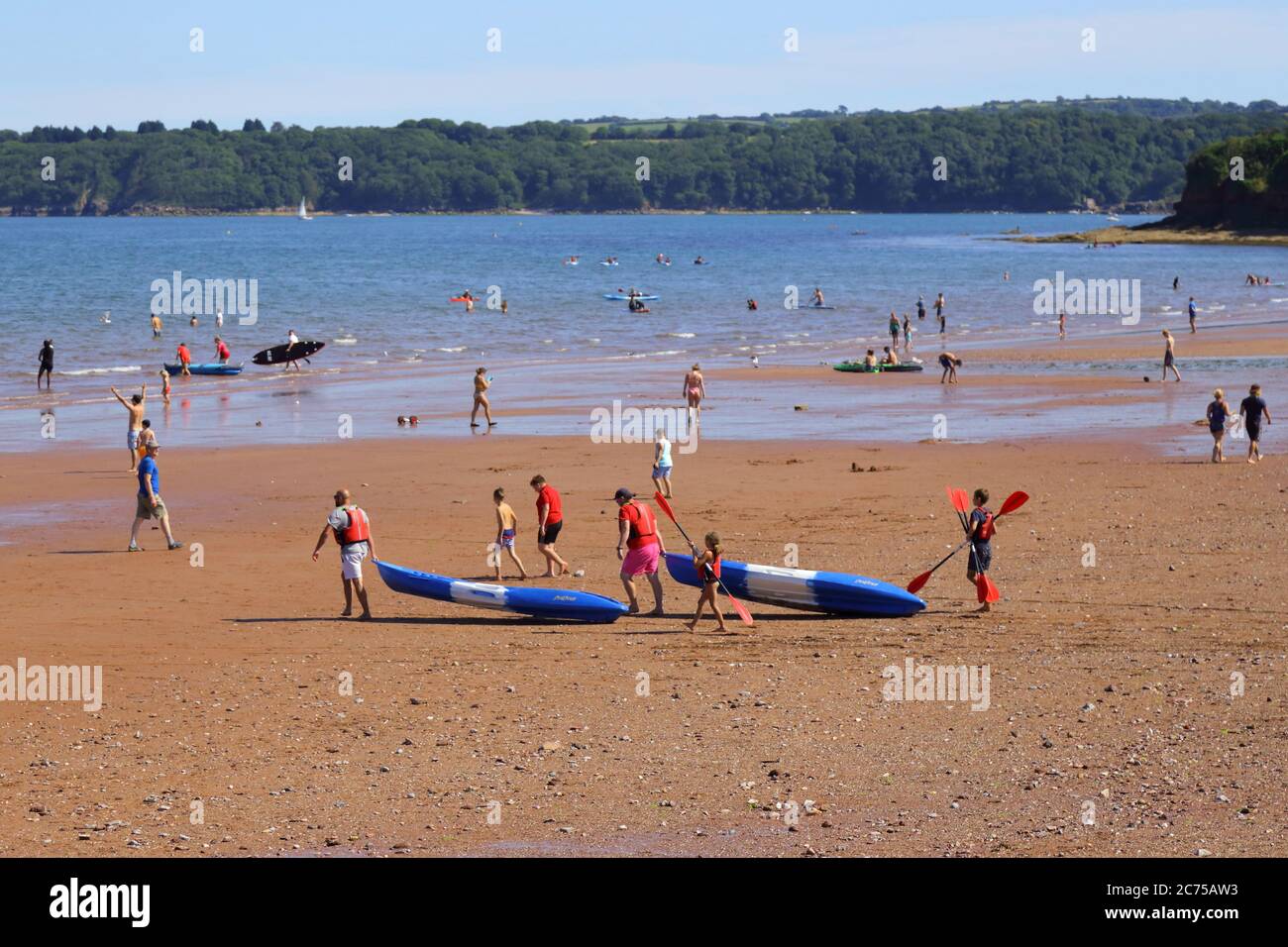 Beach people water sunbathing hi-res stock photography and images - Alamy