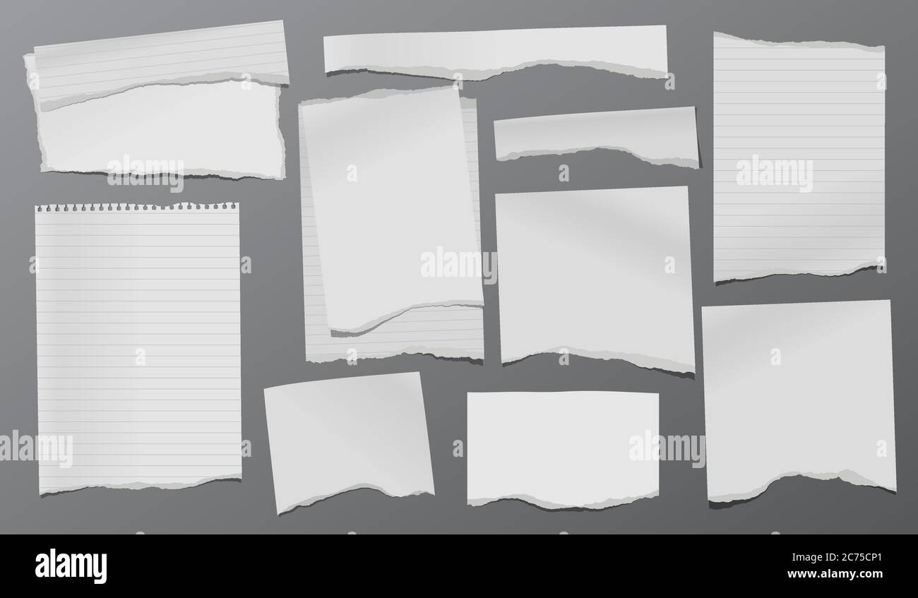 Torn of white note, notebook paper strips and pieces stuck on dark grey ...