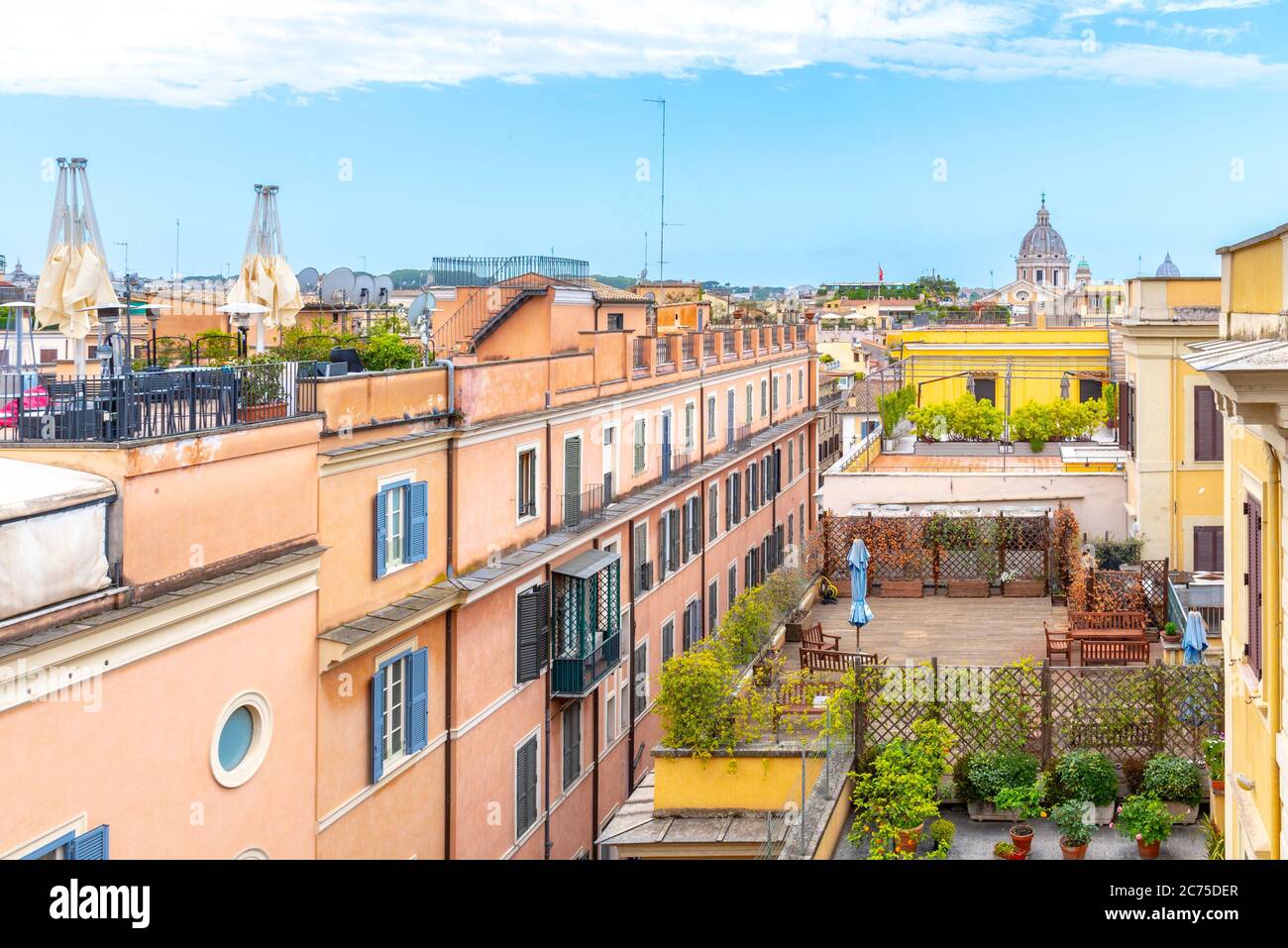 Rome skyline with old colorful houses and rooftop terraces on sunny day ...