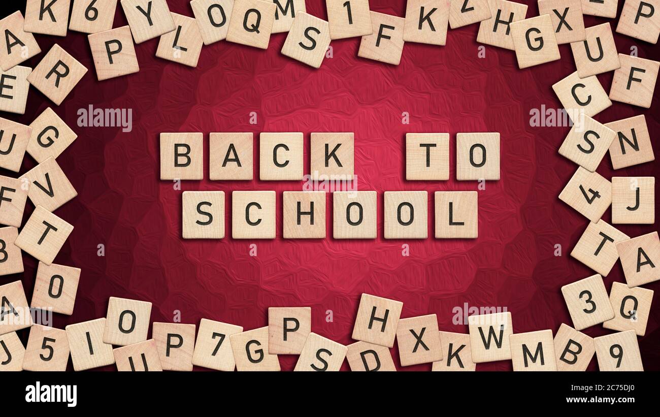 Back to school written with wooden tiles over red background. This ...