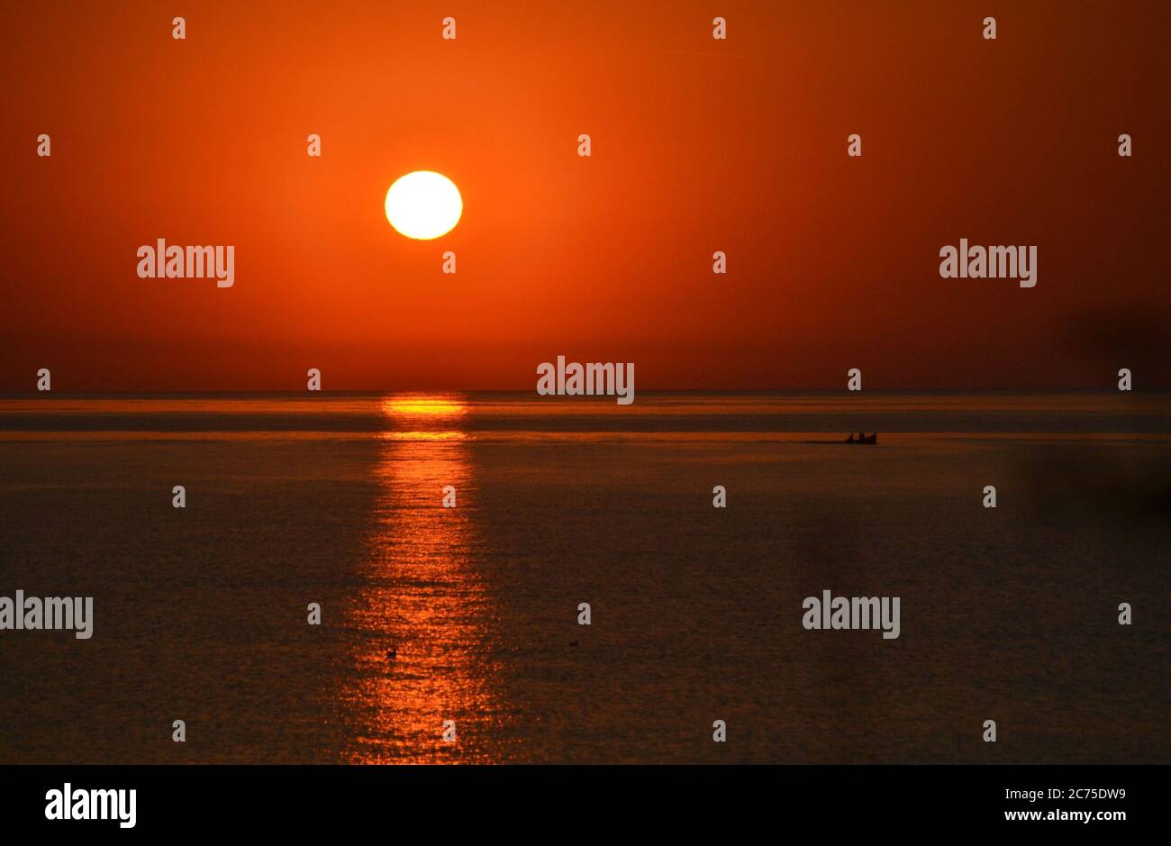 Round sun rising over the sea, Vama Veche, Romania Stock Photo - Alamy