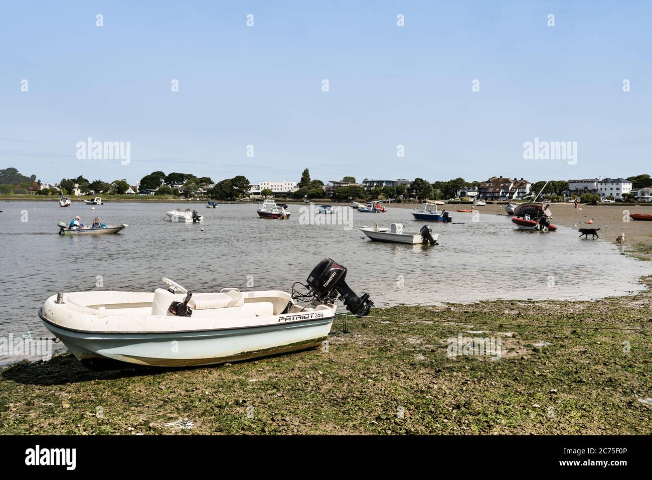 Small motor fishing boat on the beach at Mudeford Harbour Stock Photo ...