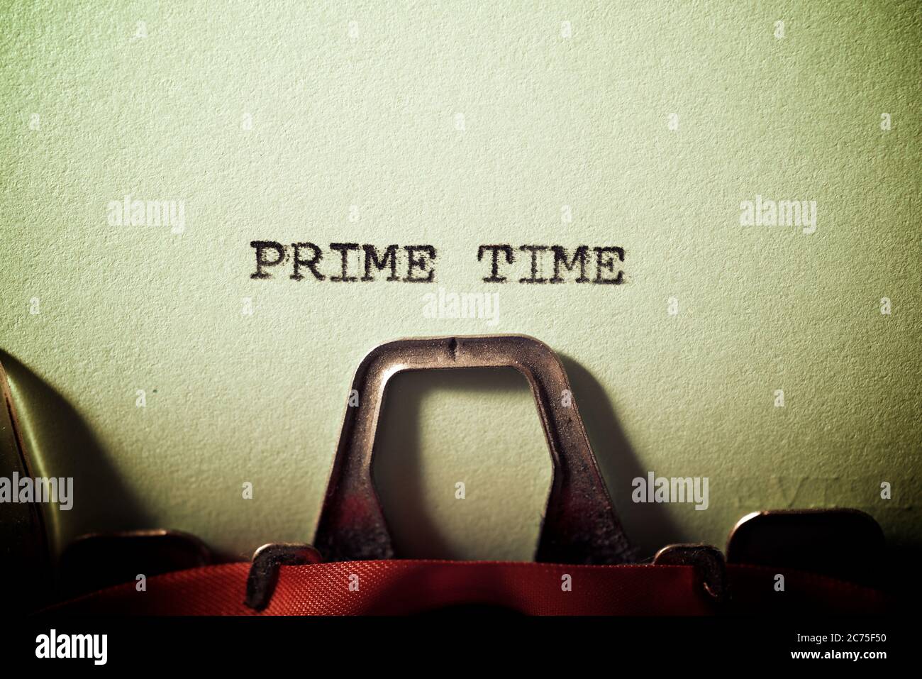 Prime time text written with a typewriter Stock Photo - Alamy