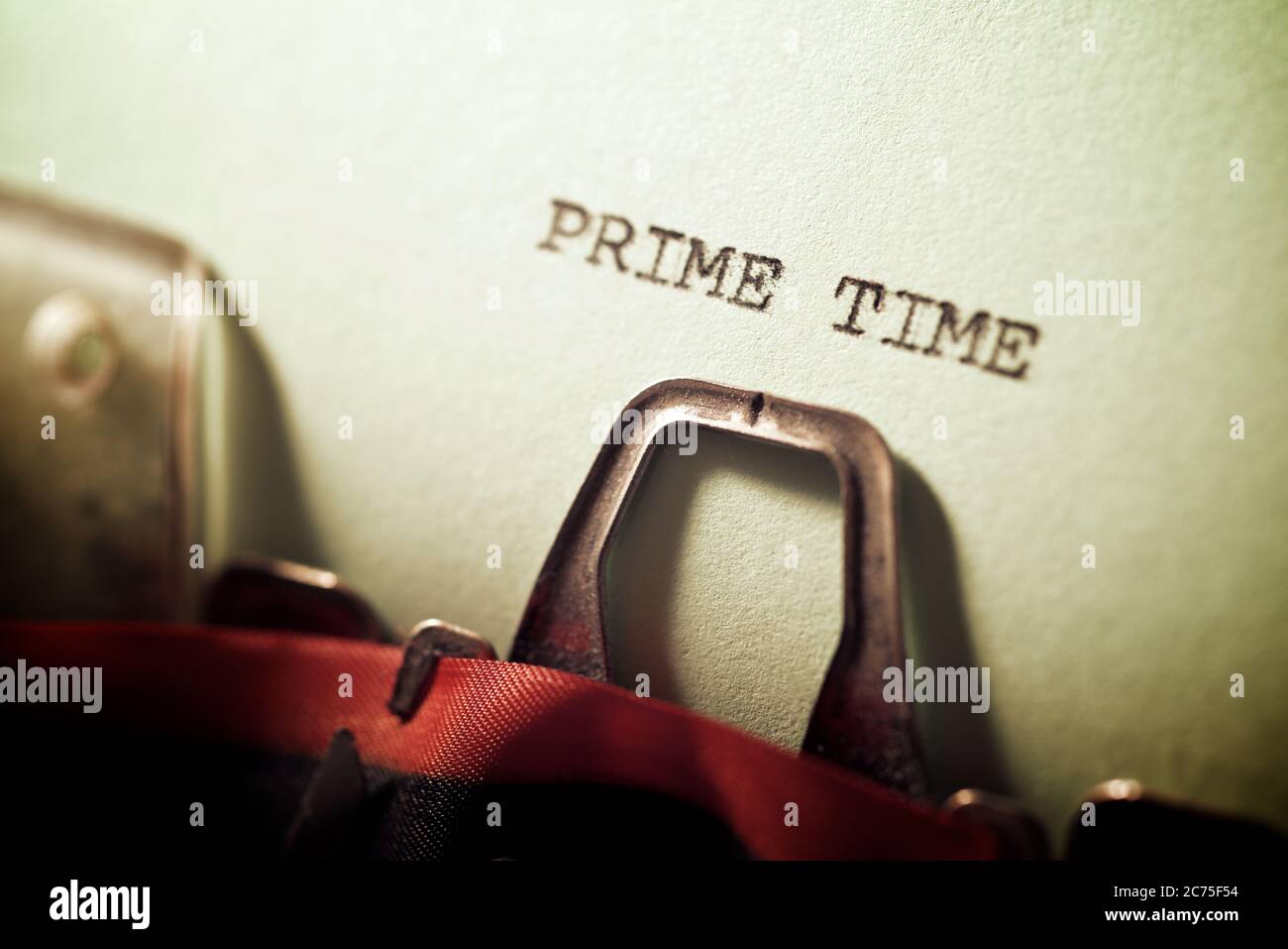 Prime time text written with a typewriter Stock Photo - Alamy