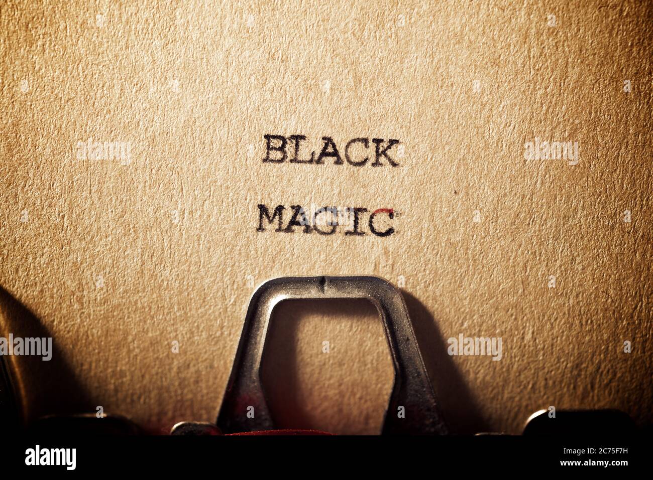 Black magic text written with a typewriter Stock Photo - Alamy